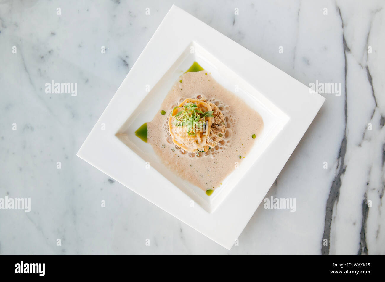 Spinach and ricotta stuffed vegetarion Tortellini Ravioli with white ...