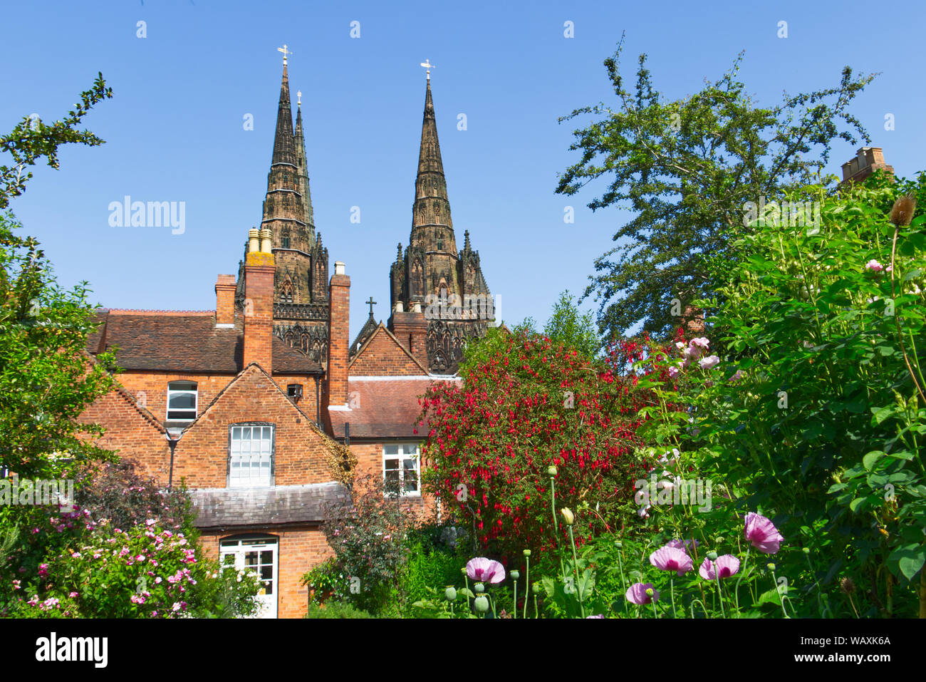A view of the three spires of Lichfield Cathedral from the herb garden ...