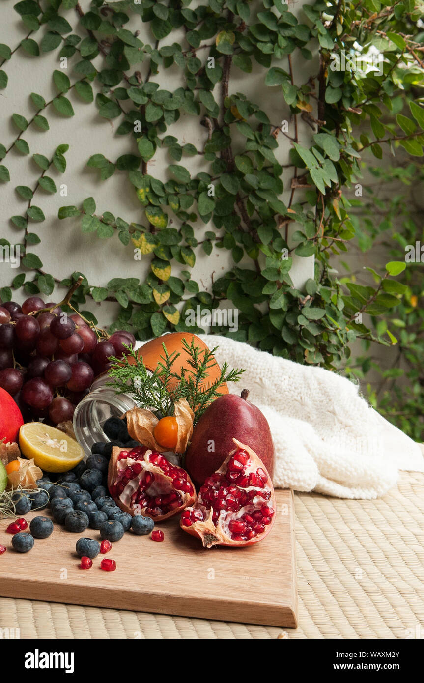 Healthy eating theme with different kind of fruits on wooden background ...