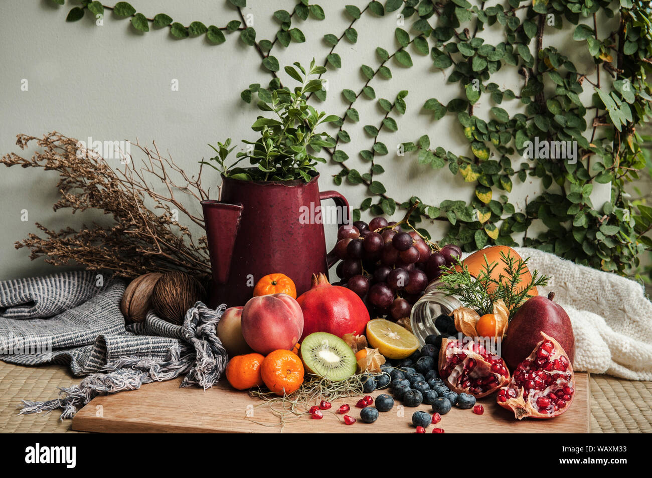 Healthy eating theme with different kind of fruits on wooden background ...