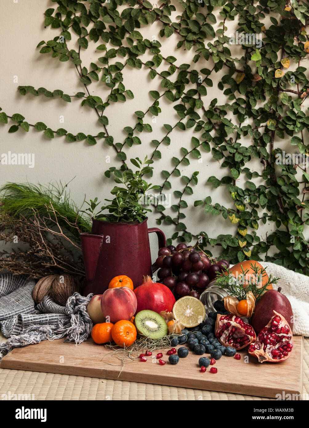 Healthy eating theme with different kind of fruits on wooden background ...