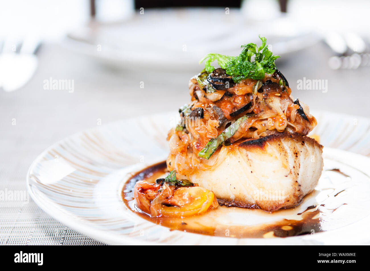 Grilled cod fish with vegetables and balsamic sauce Stock Photo - Alamy