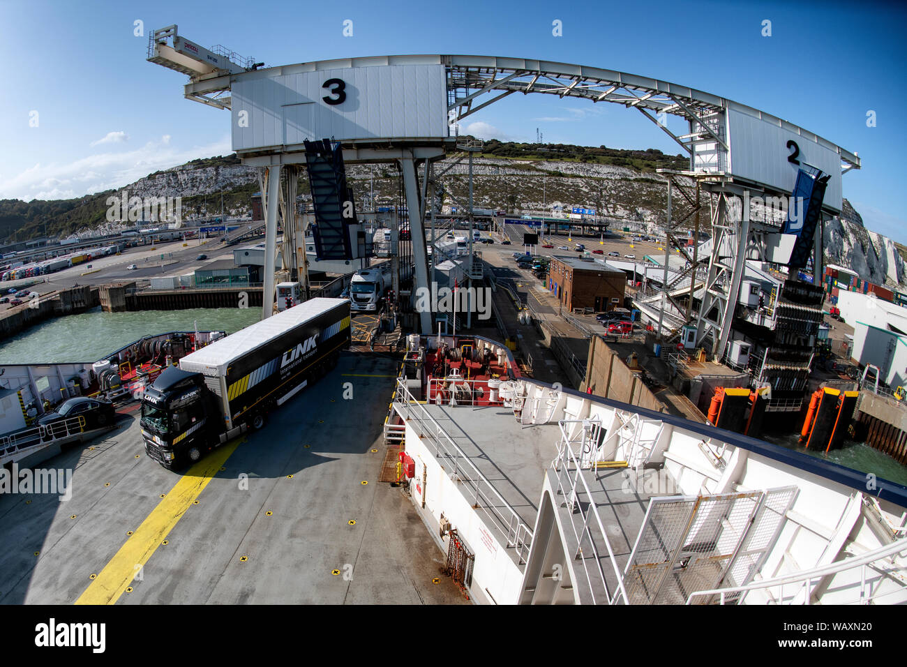 Lorries drive on to a cross channel ferry at the port of Dover in the ...
