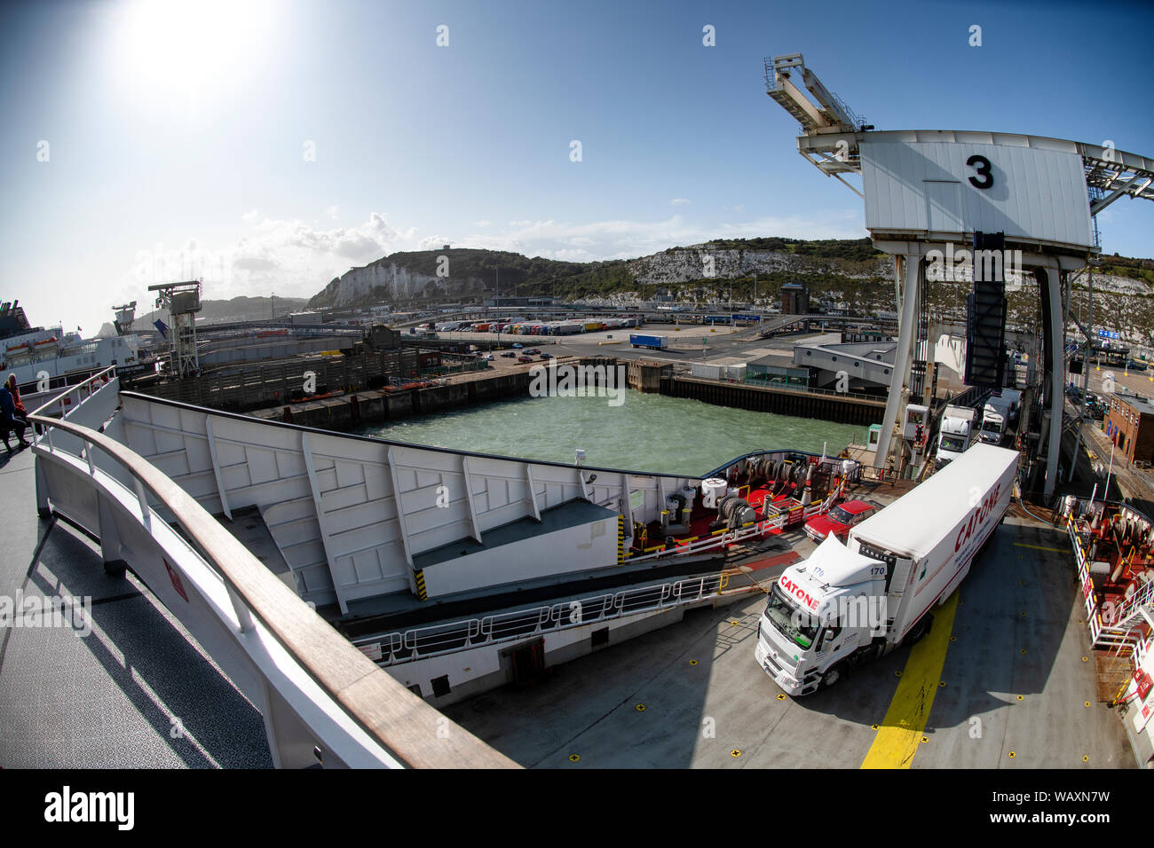 Lorries drive on to a cross channel ferry at the port of Dover in the ...