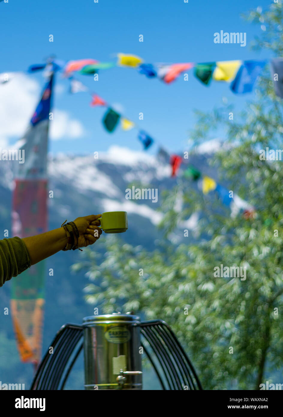 Tea and tibetan flag in himalayas cafe Stock Photo - Alamy
