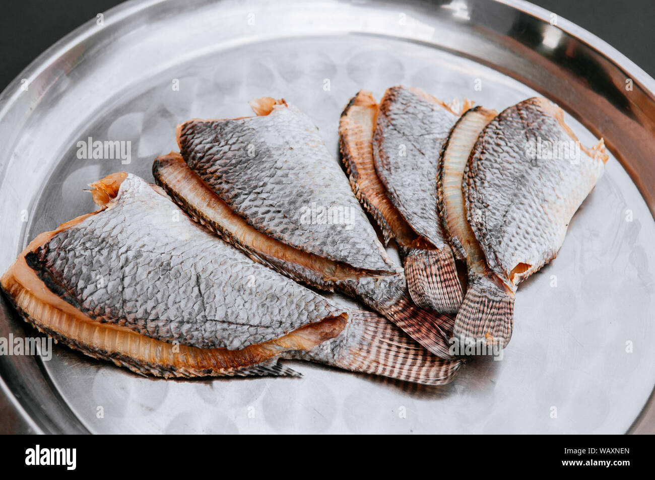 Couples Sun dried salted Tilapia fish on stainless tray - Asian local ...