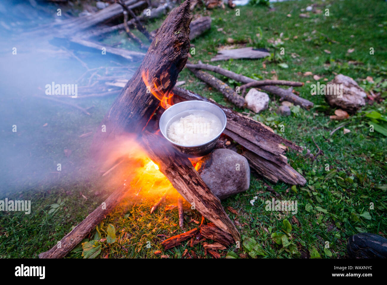 Cooking dinner on wood. Cooking using wood is an survival skill needed ...