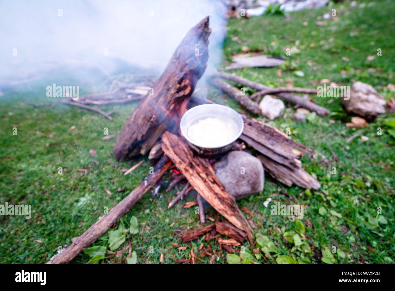 Cooking dinner on wood. Cooking using wood is an survival skill needed ...