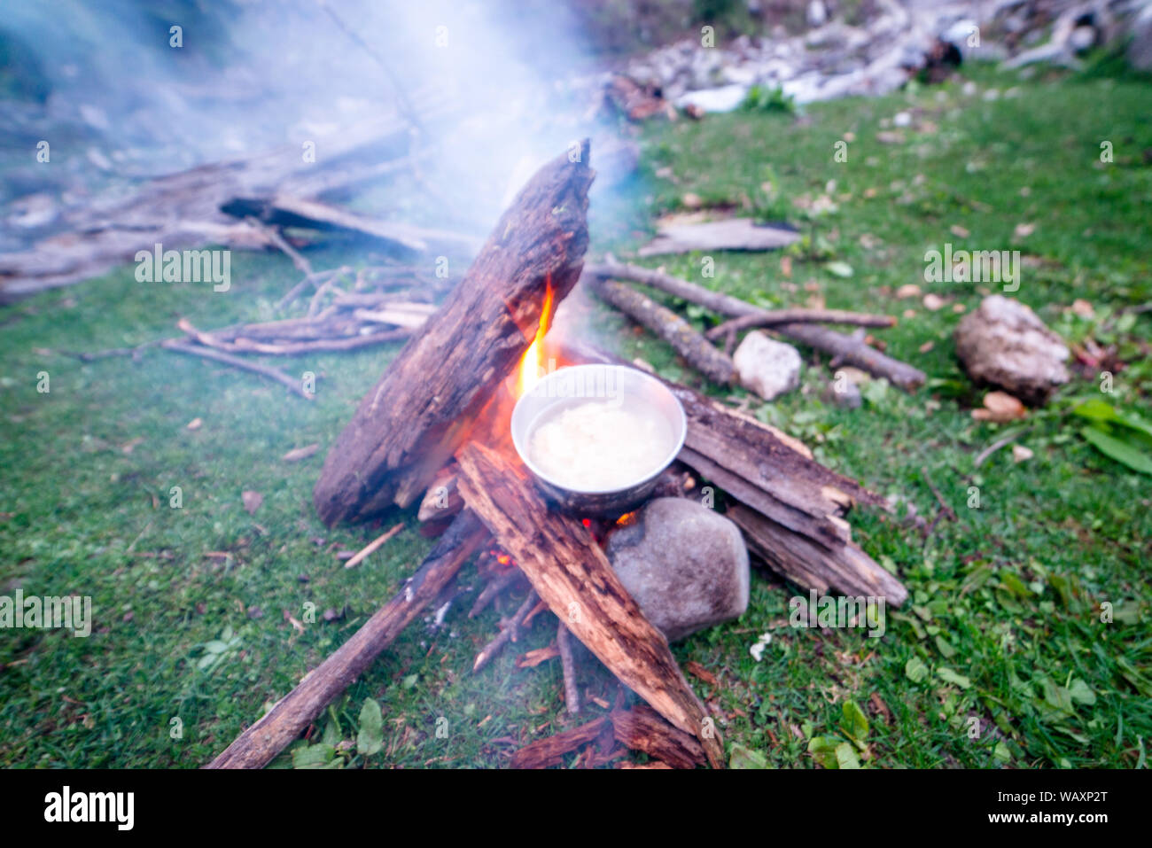 Cooking dinner on wood. Cooking using wood is an survival skill needed ...