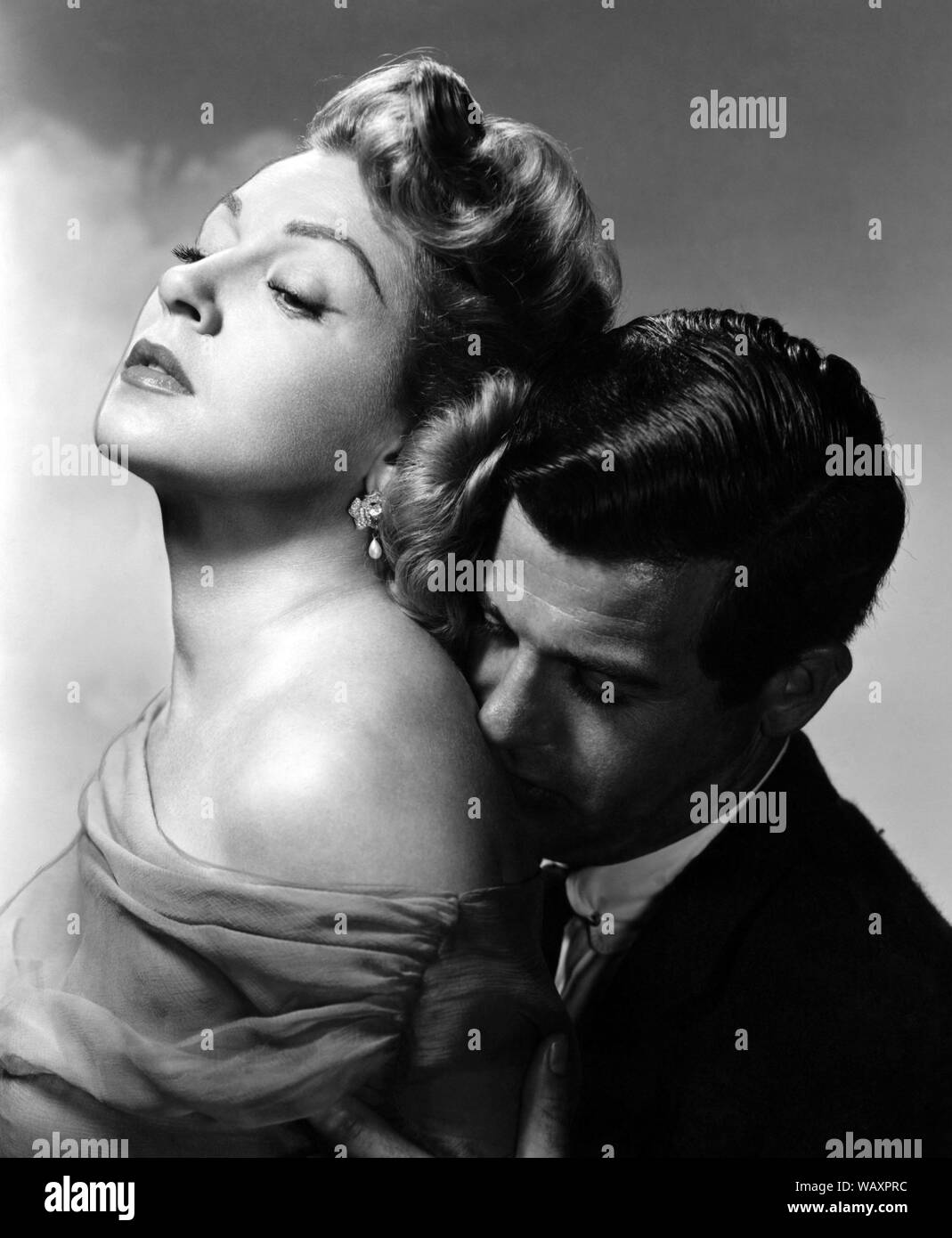 LANA TURNER and LEE PHILIPS in PEYTON PLACE (1957), directed by MARK ...