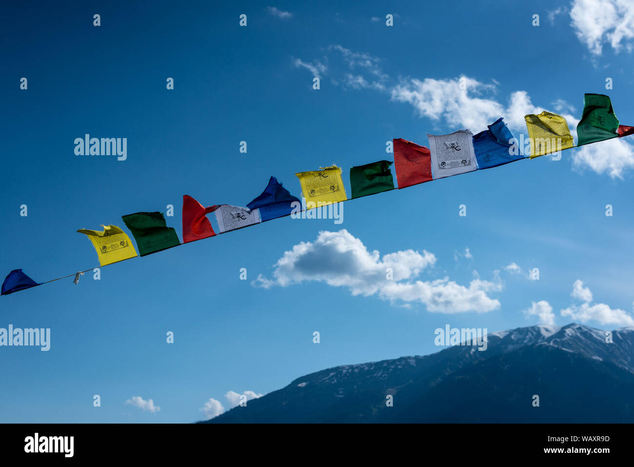 Budhist flags in the mountains near hamta Stock Photo - Alamy