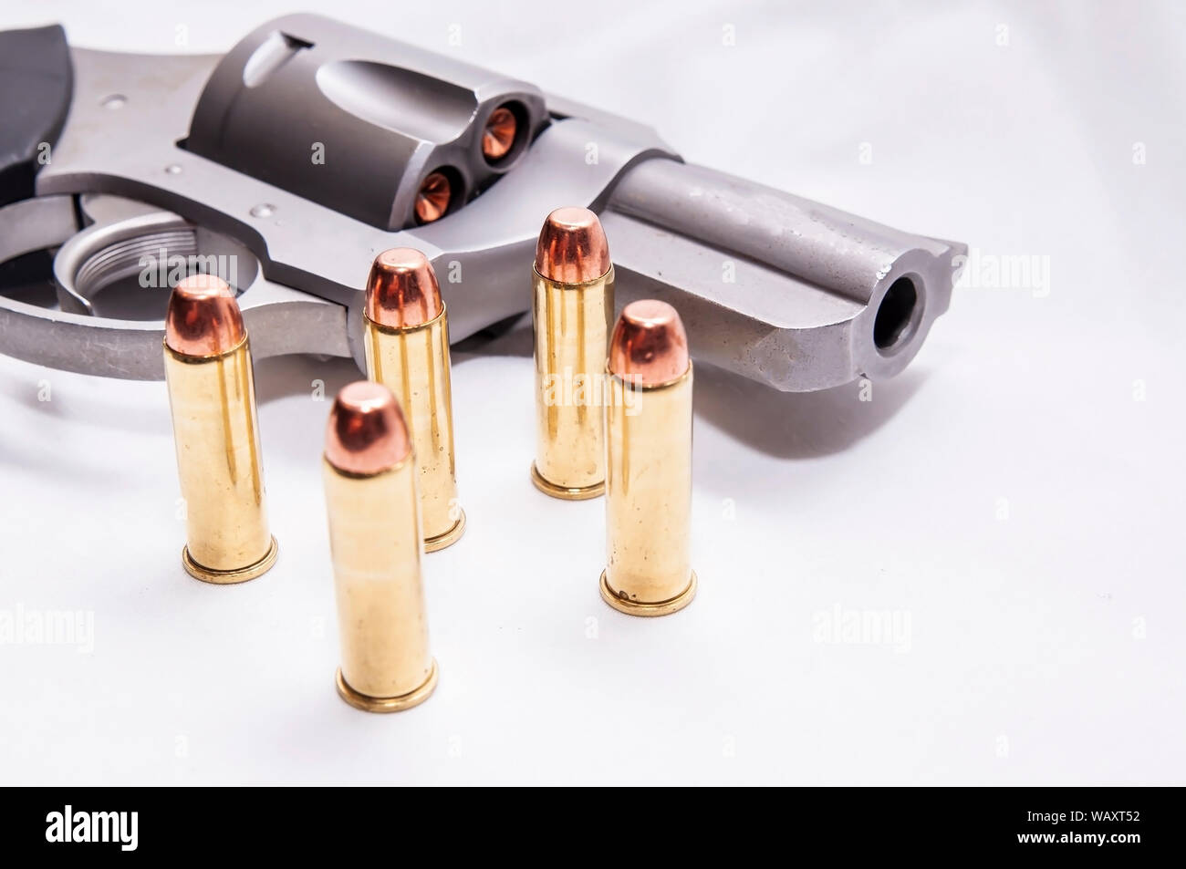 A stainless, snub nosed 357 magnum revolver with five full metal jacket ...