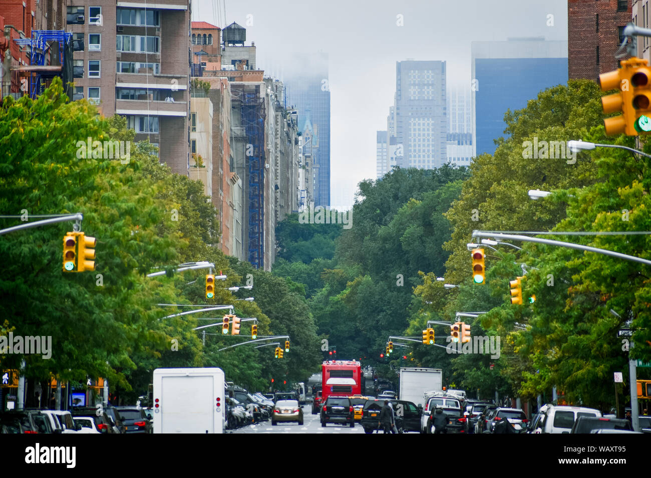Manhattan buildings skyline from 5th ave. Harlem in a foggy day ...
