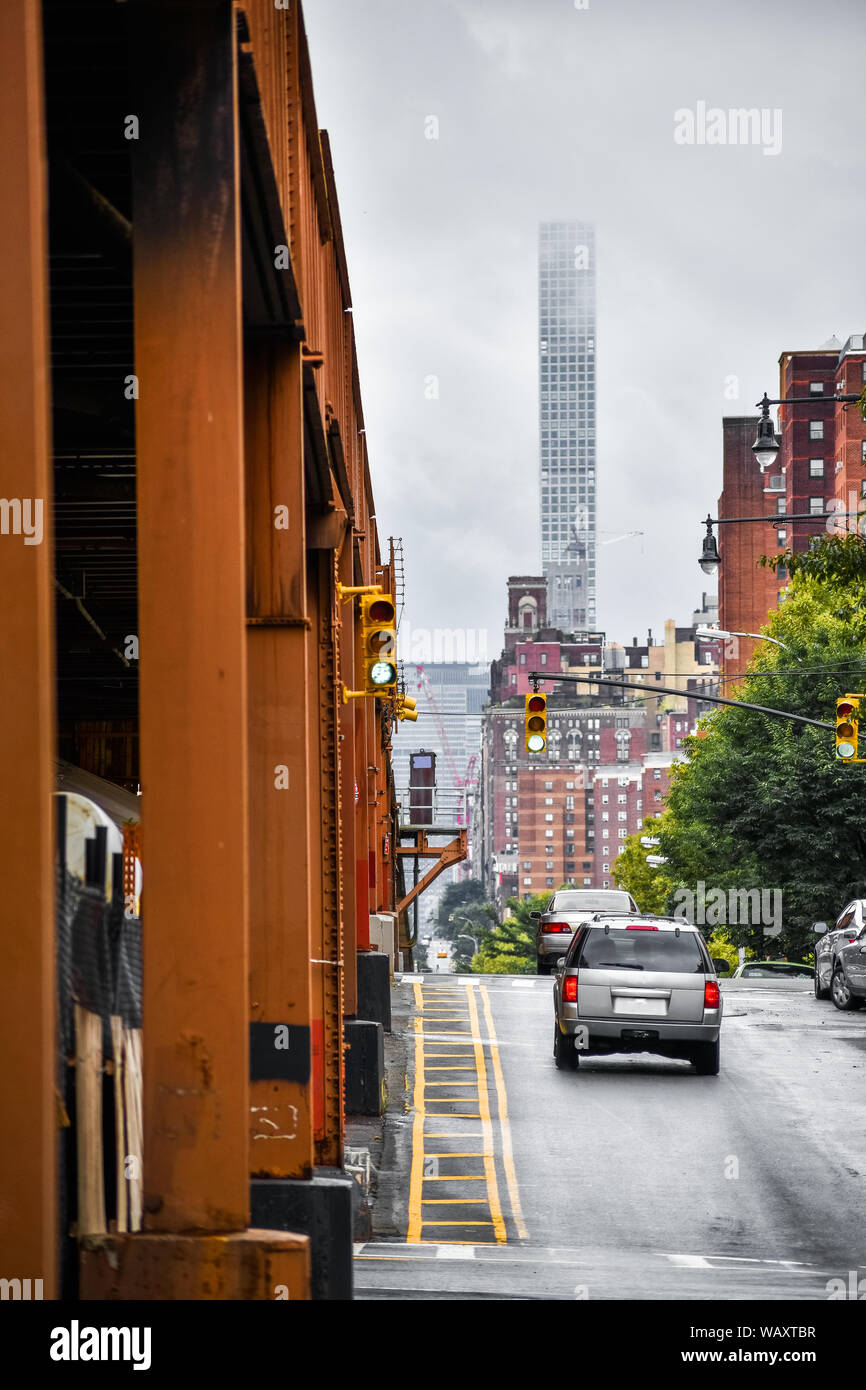 Bottom view of Elevated train track nyc. Buildings in the background in ...