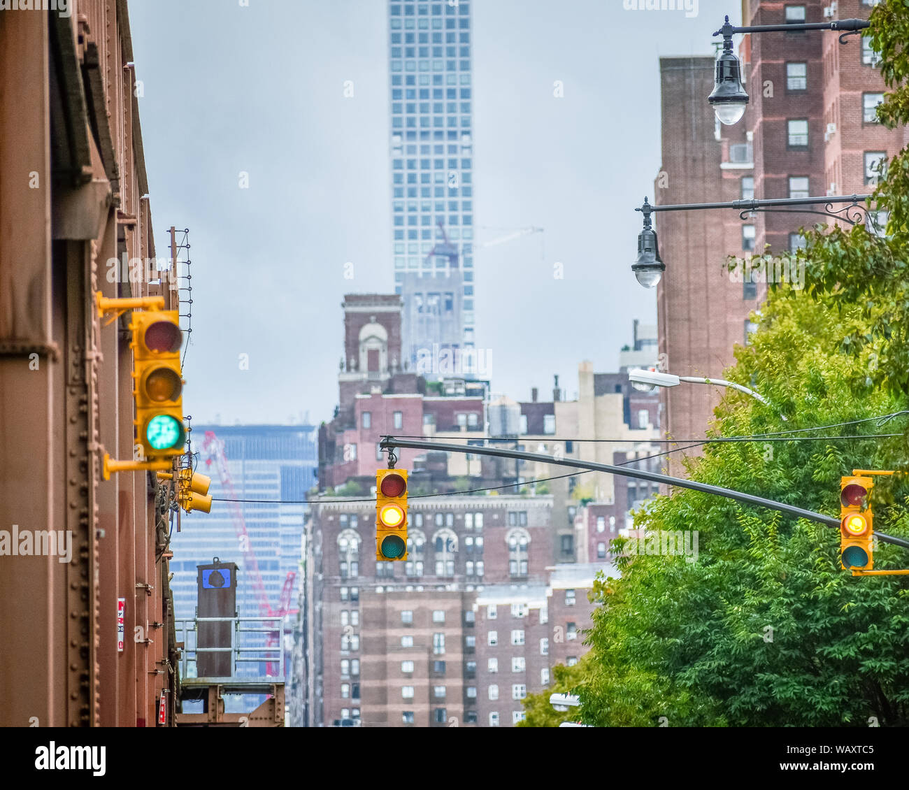 Bottom view of Elevated train track nyc. Buildings in the background in ...