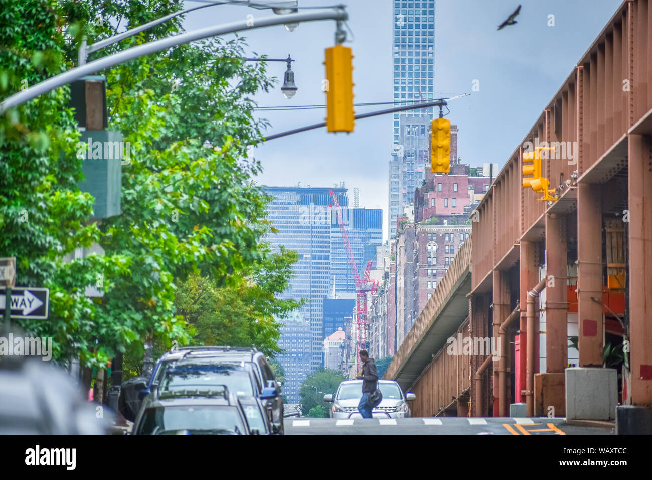 Bottom view of Elevated train track nyc. Buildings in the background in ...
