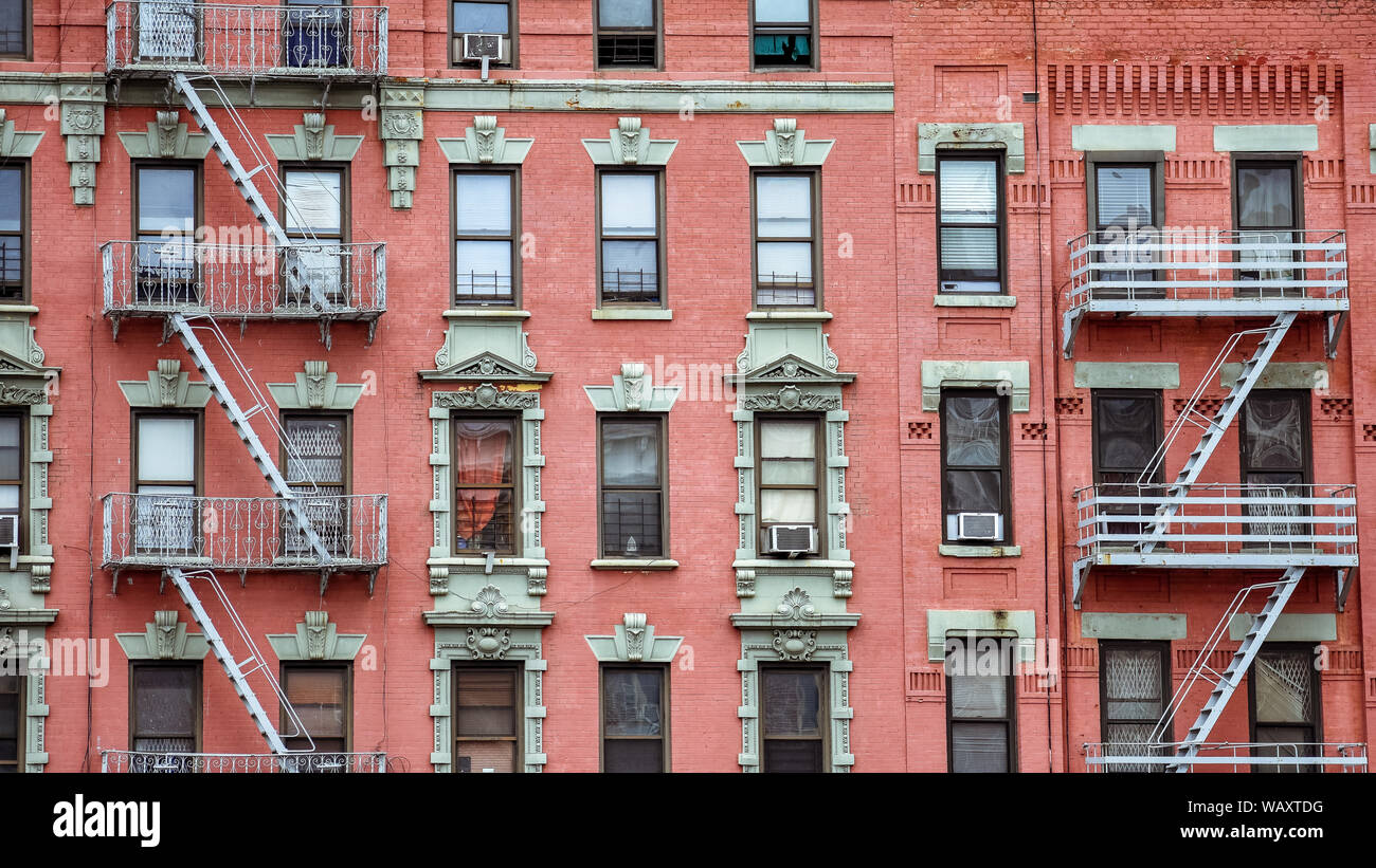 Red brick facade, and fire stairs. Harlem, NYC Stock Photo - Alamy