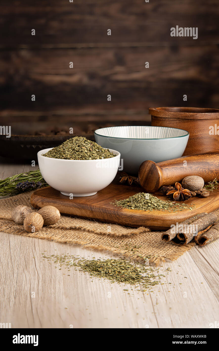 Dried Coriander Leaf in a bowl and food preparation and kitchen setting ...