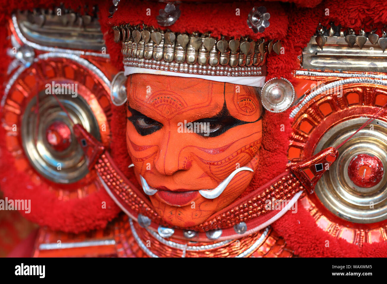 Dancer at a traditional Theyyam ceremony in a temple in Kannur, India ...