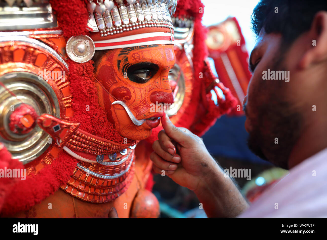 Dancer at a traditional Theyyam ceremony in a temple in Kannur, India ...