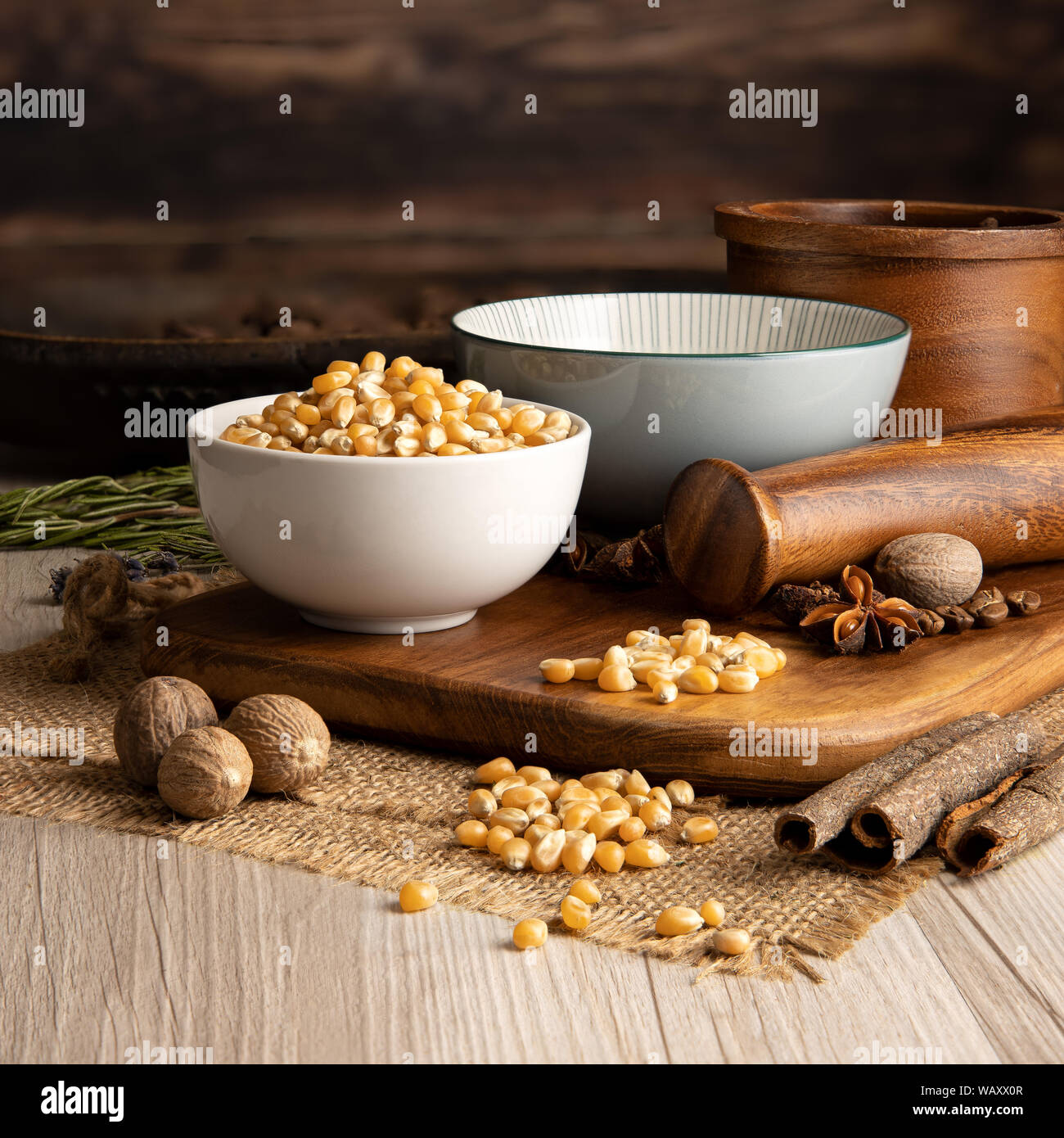 Popcorn corn kernels in a bowl and food preparation and kitchen setting ...