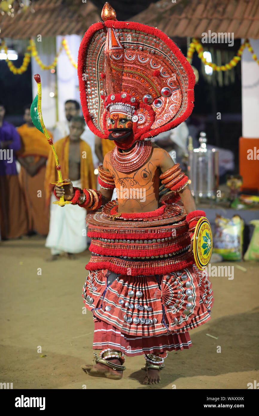Dancer at a traditional Theyyam ceremony in a temple in Kannur, India ...