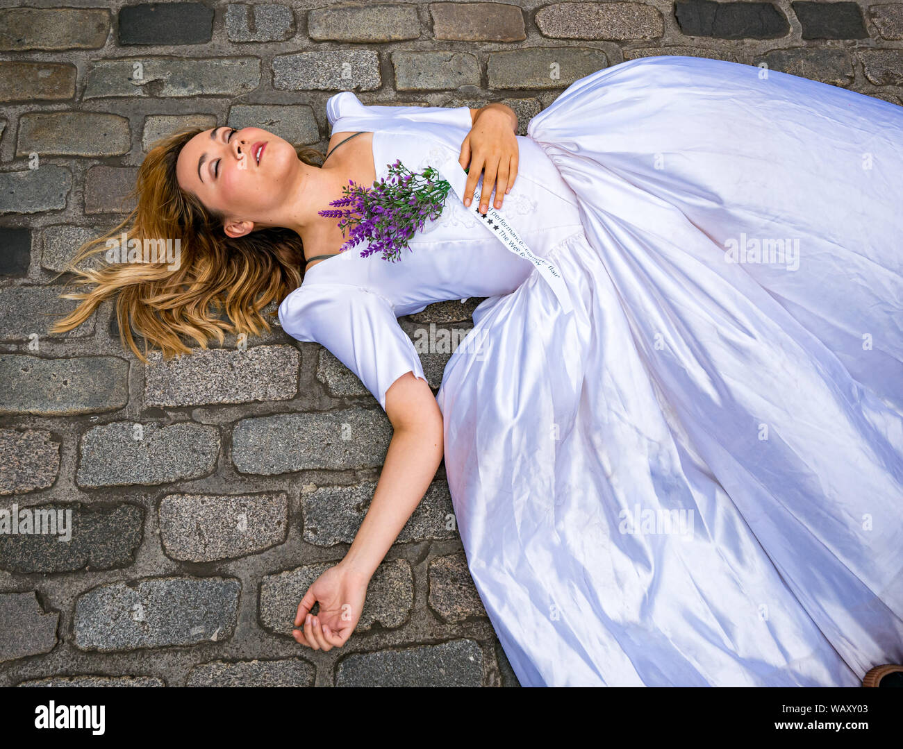 Young woman lying down dead hi-res stock photography and images - Alamy