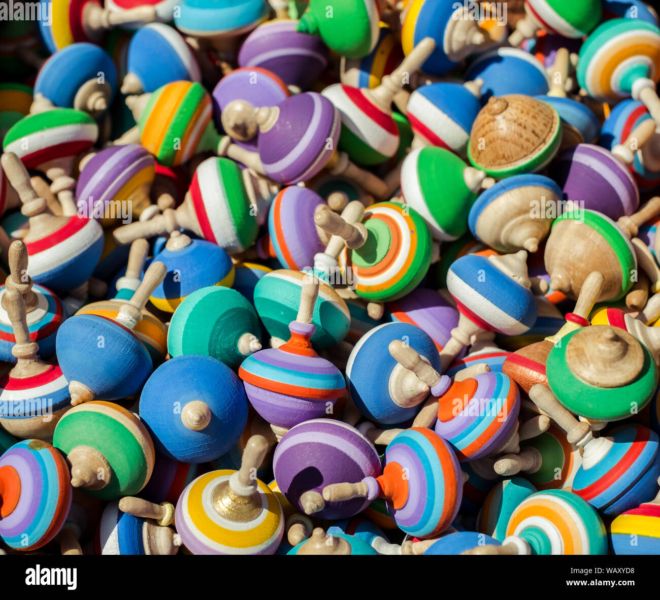 wood spinning tops collors Stock Photo - Alamy