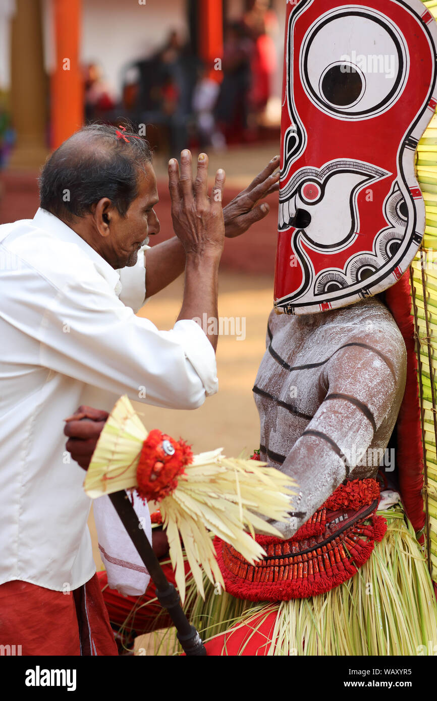 Dancer at a traditional Theyyam ceremony in a temple in Kannur, India ...
