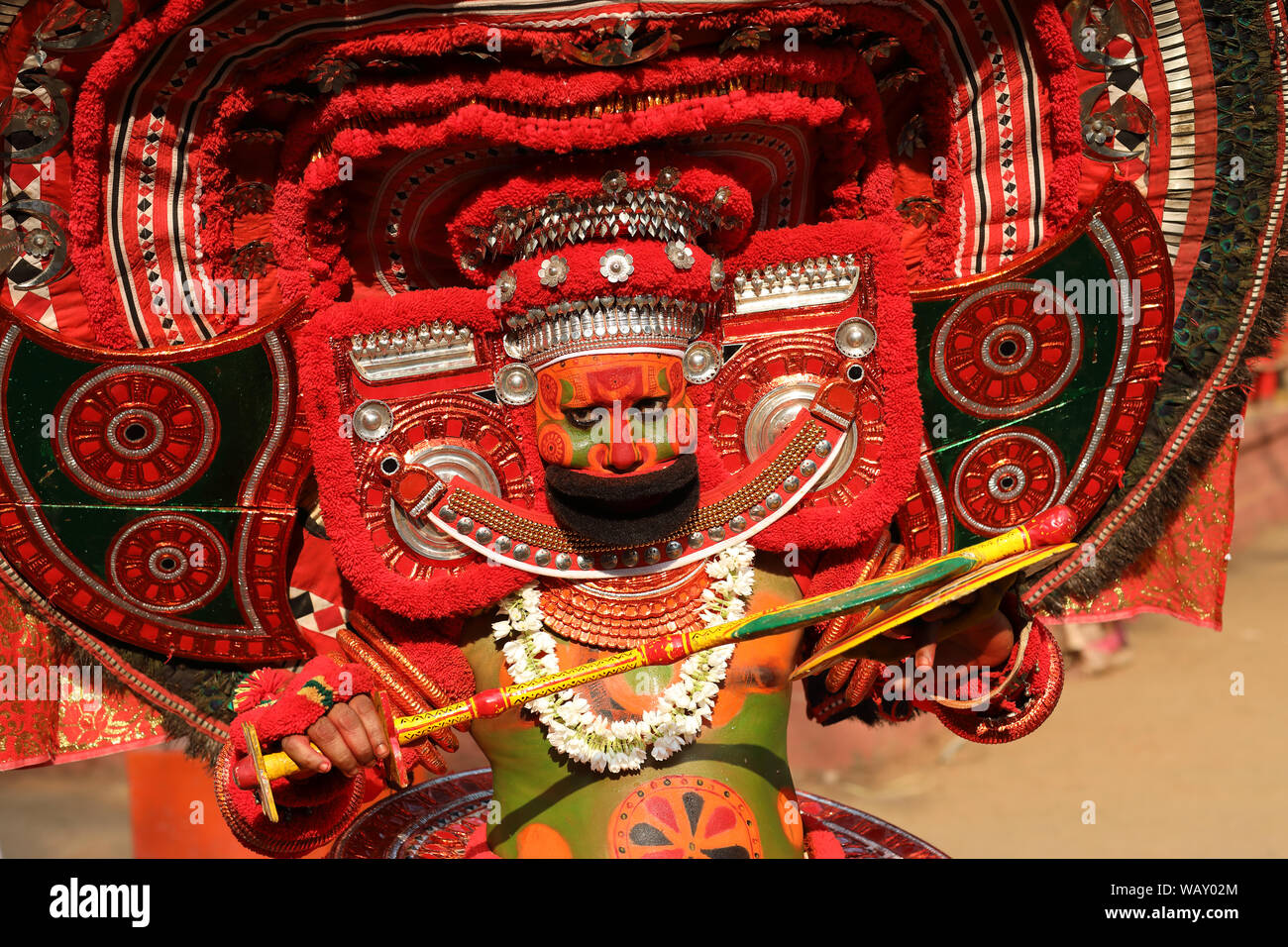 Dancer at a traditional Theyyam ceremony in a temple in Kannur, India ...
