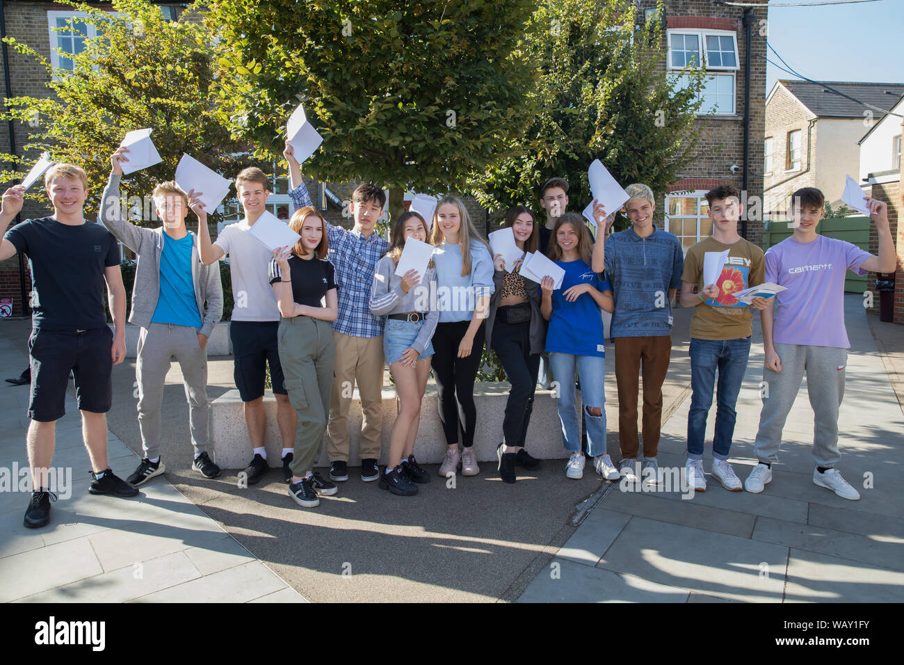 Kingston Grammar School students celebrate and congratulate each other ...