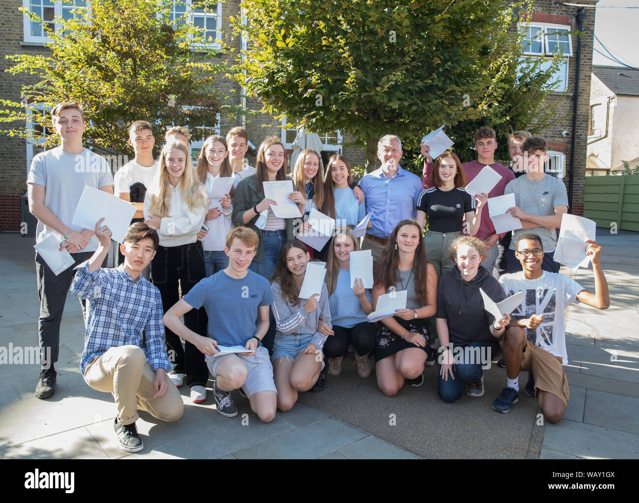 Kingston Grammar School students celebrate and congratulate each other ...