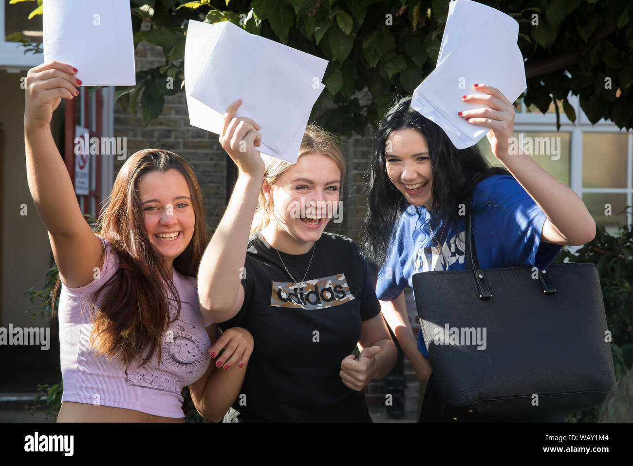 Kingston Grammar School students celebrate and congratulate each other ...