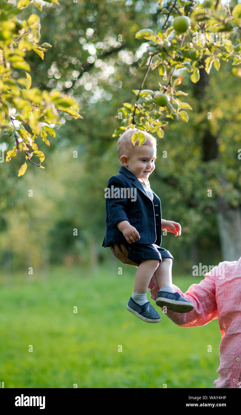 Boy under apple tree hi-res stock photography and images - Alamy