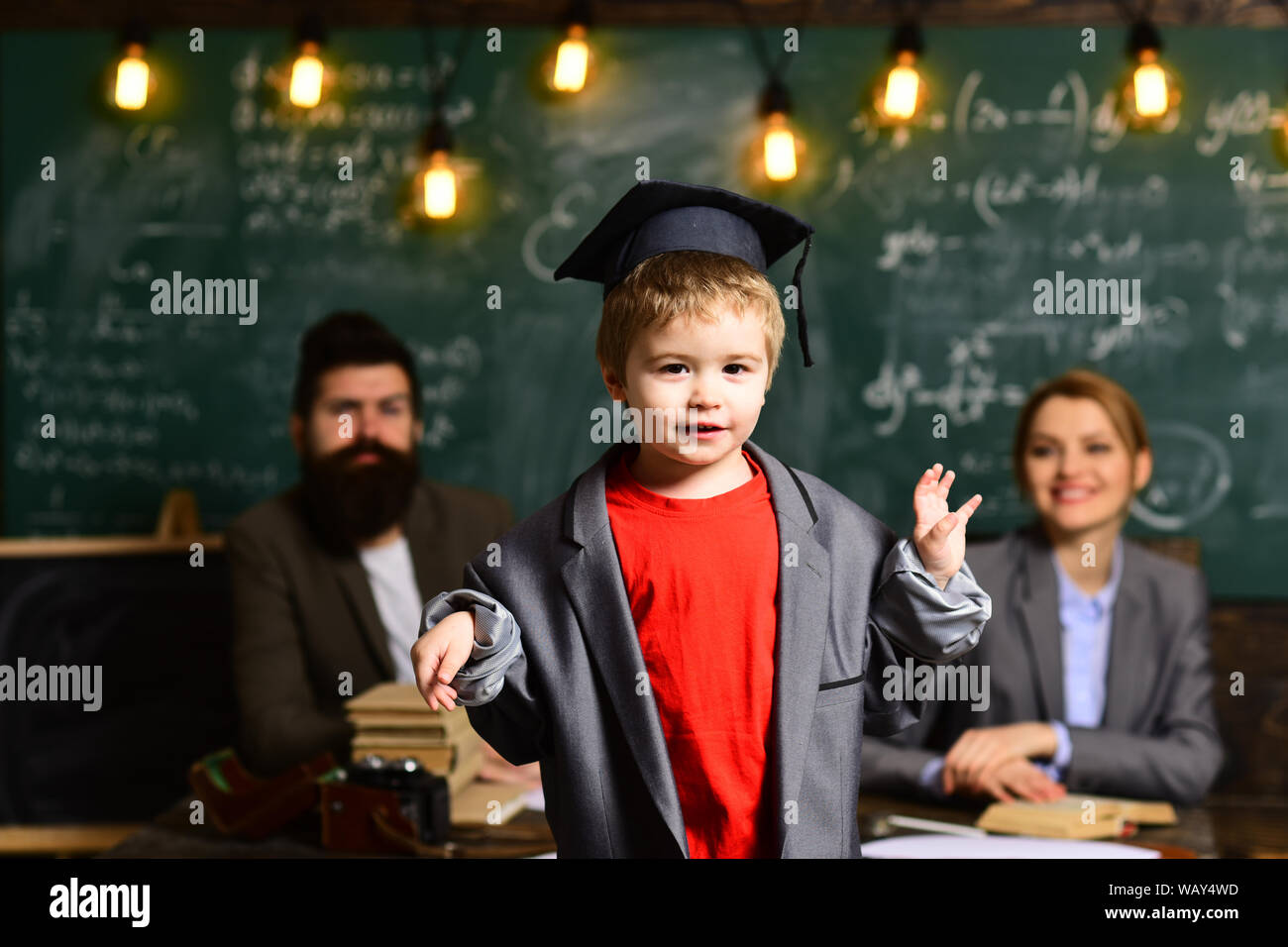 Kindergarten graduation day. Family of mother, father and son on kinder ...