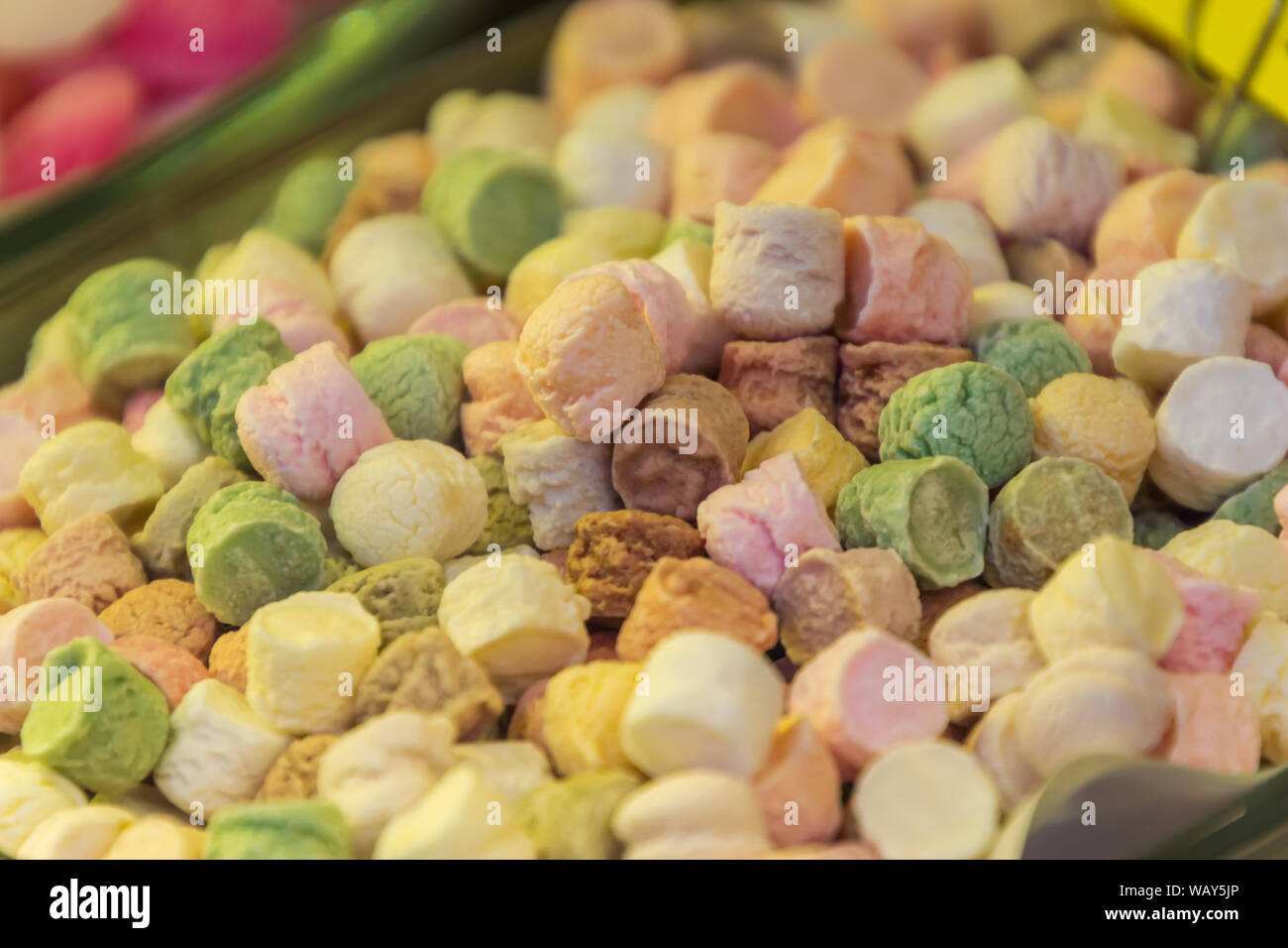 Different colorful round candies in the sweets shop for background ...