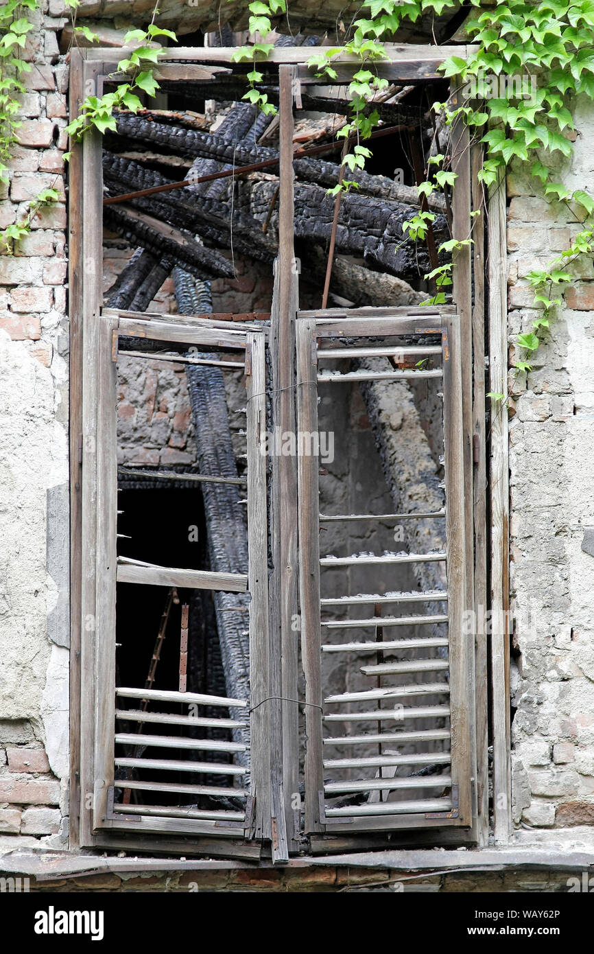 View of house after fire try window Stock Photo - Alamy