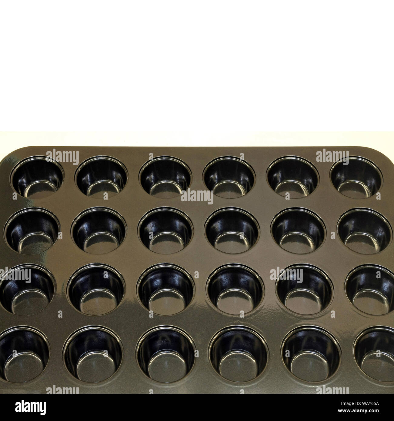 Baking tray for small cakes isolated on white Stock Photo - Alamy