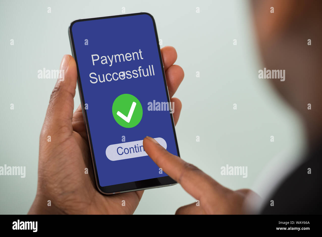 Close-up Of Person's Hand Showing Payment Successful Message On ...