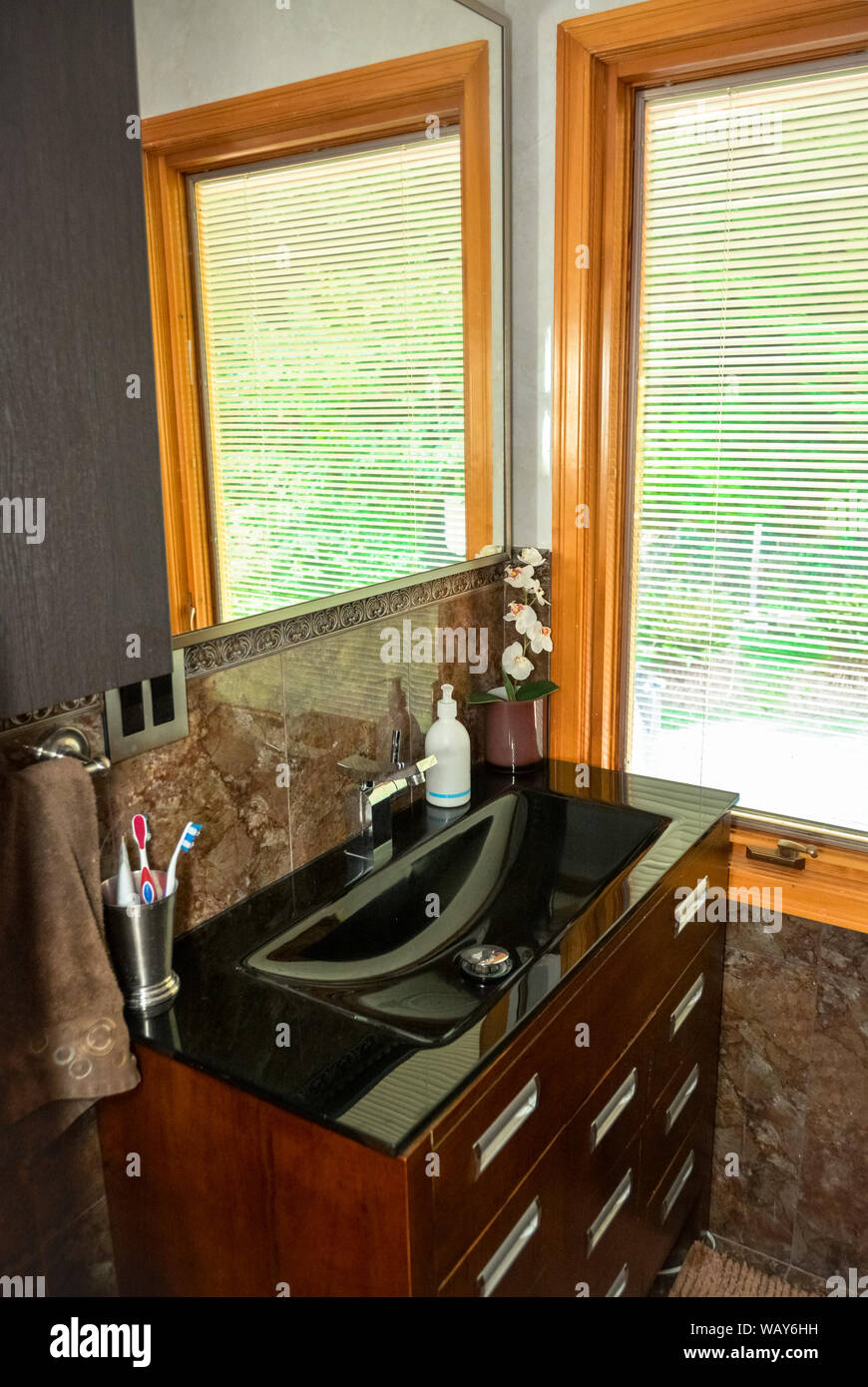 Black wash-basin at the window in a bathroom of luxury house Stock ...