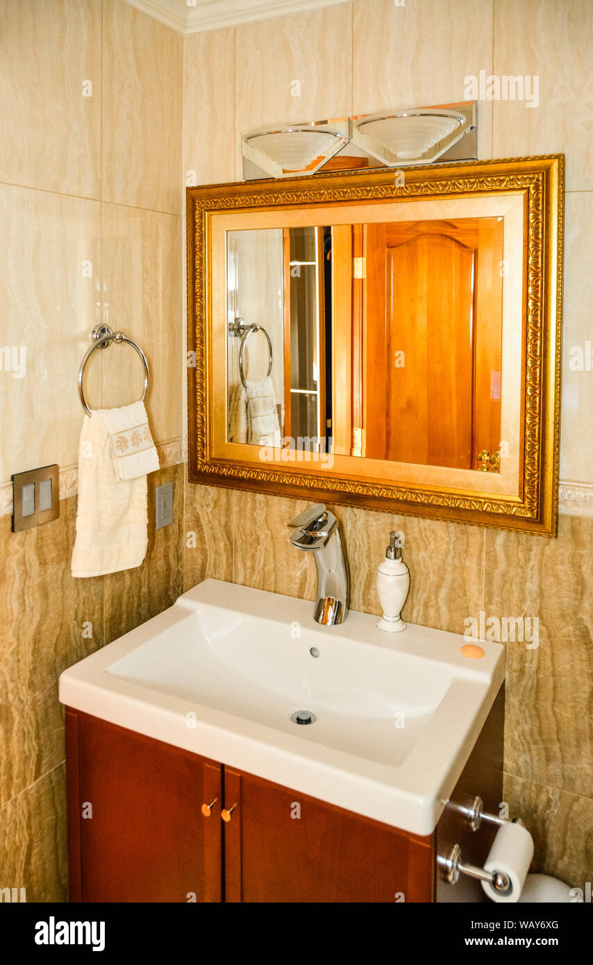 Hands wash basin with the mirror in a bathroom of luxury house Stock ...