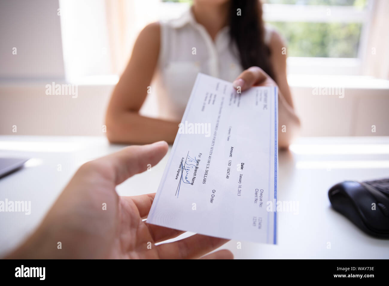 Female hand writing cheque hi-res stock photography and images - Alamy