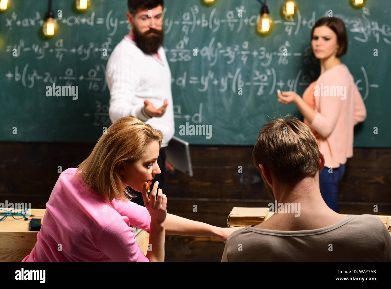 Bearded teacher, lecturer, professor watching students during test ...