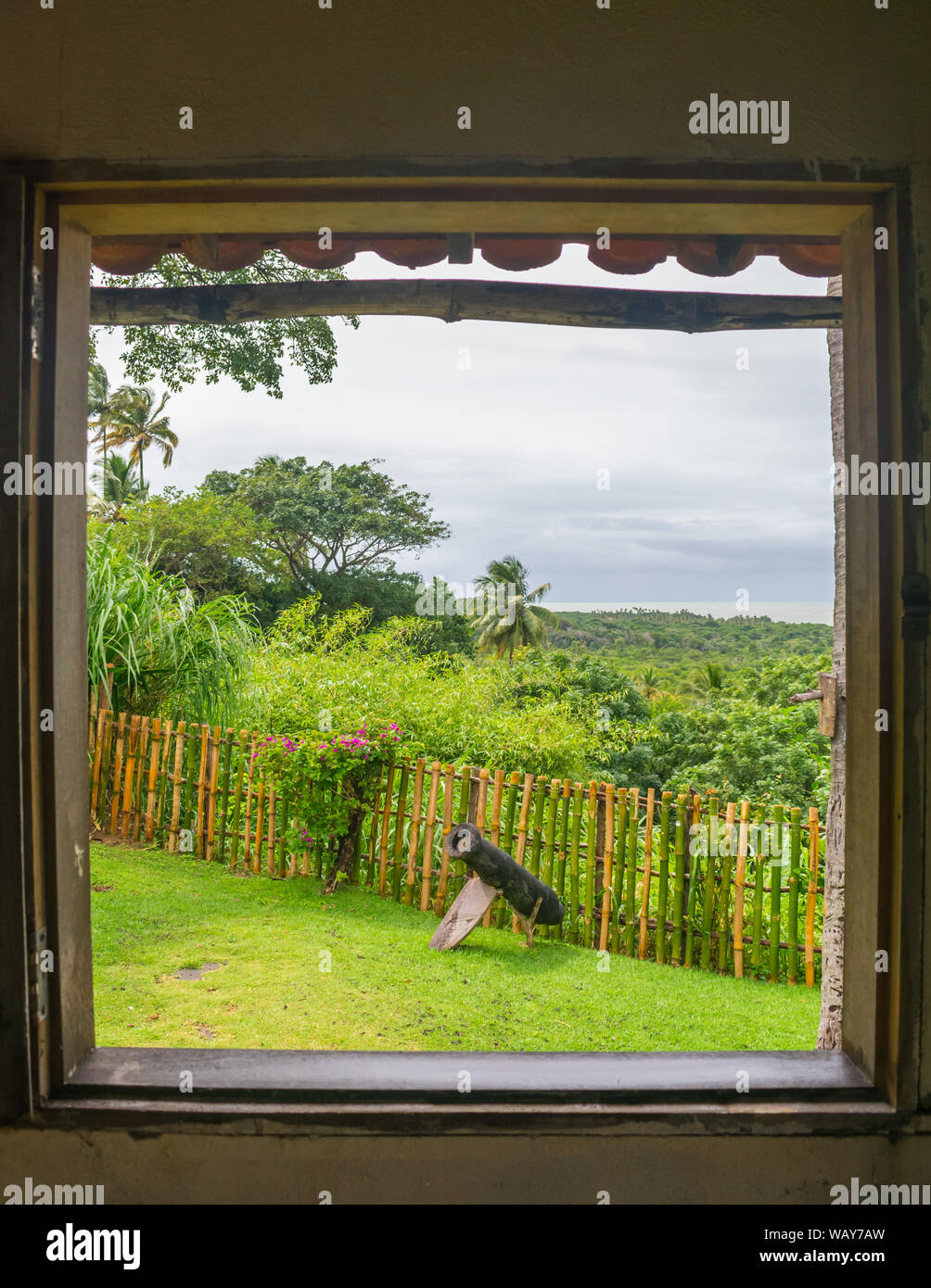 A view of the Atlantic Forest and Atlantic Ocean framed by a window in ...