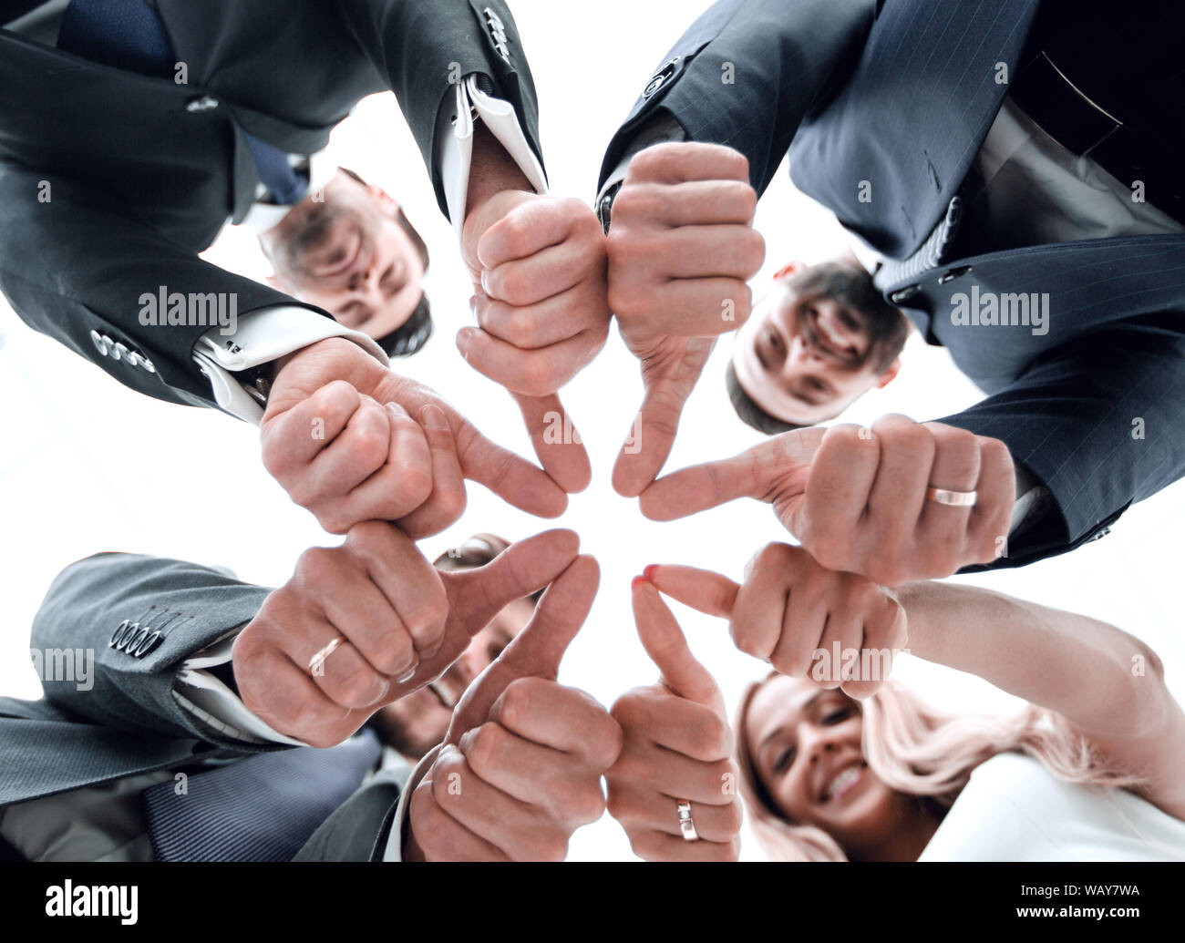 close up.business team showing their unity Stock Photo - Alamy