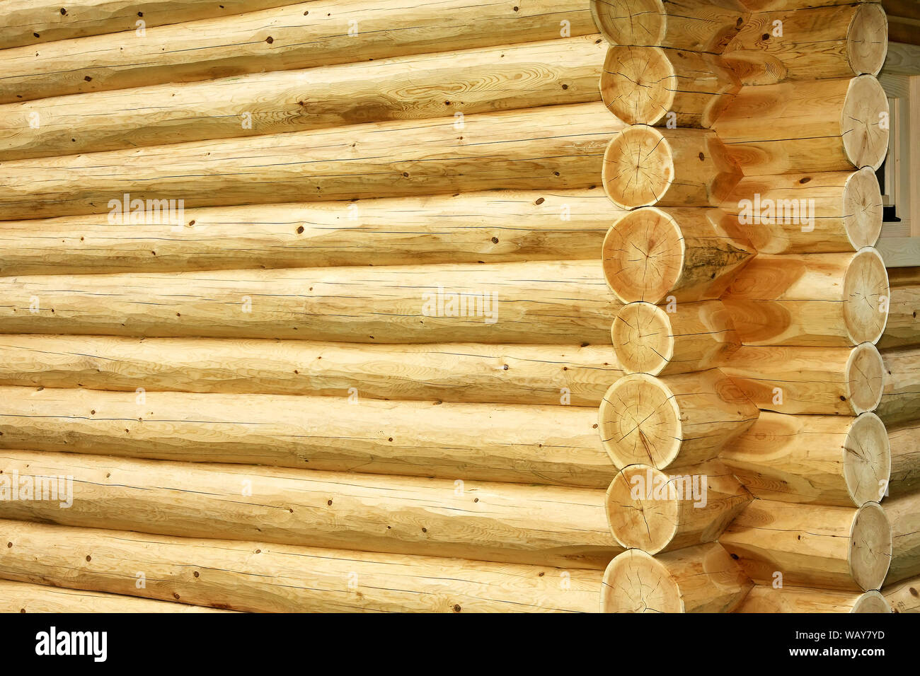 Natural background of pine balk wall joints Stock Photo - Alamy