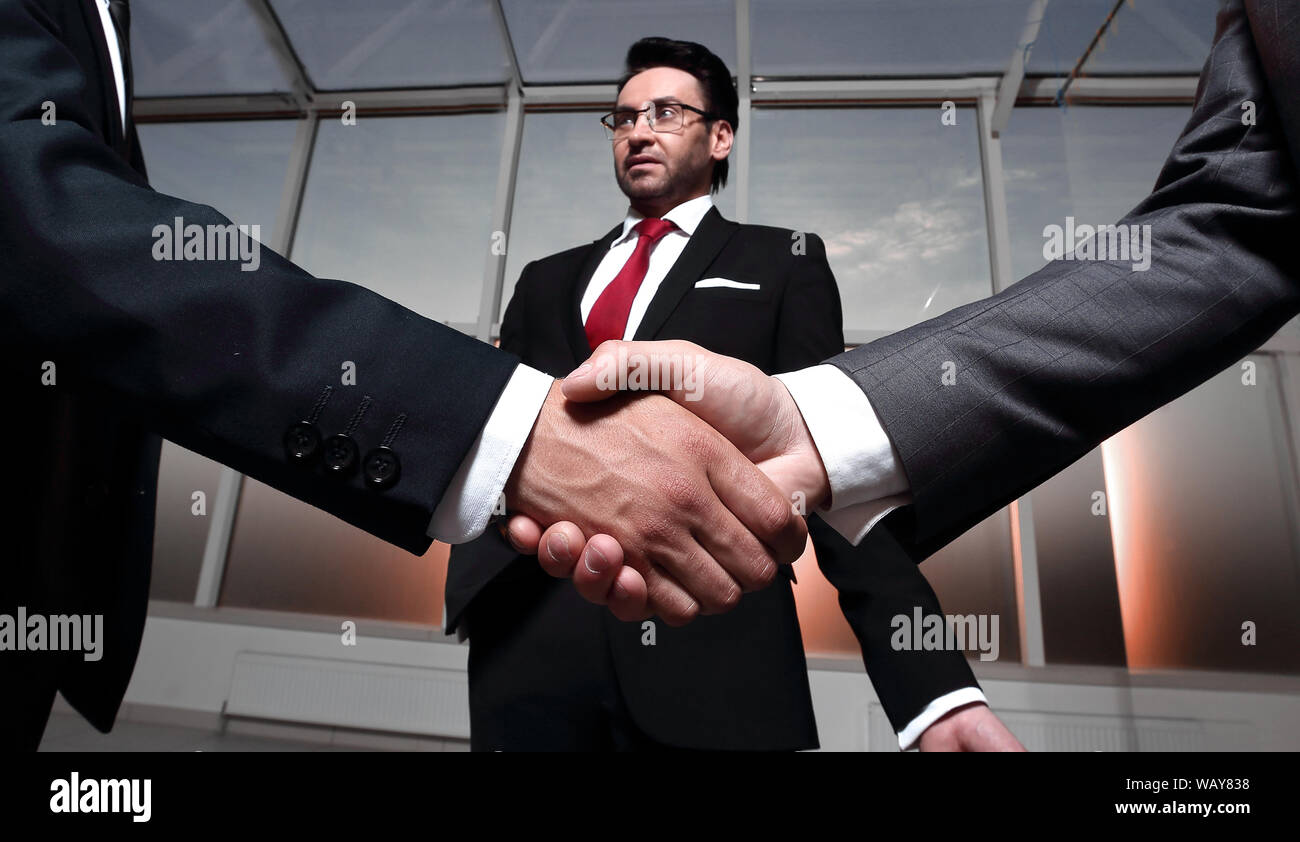 Three business shake hands hi-res stock photography and images - Alamy