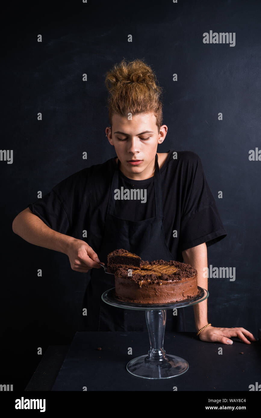 Male hands cutting chocolate cake hi-res stock photography and images ...