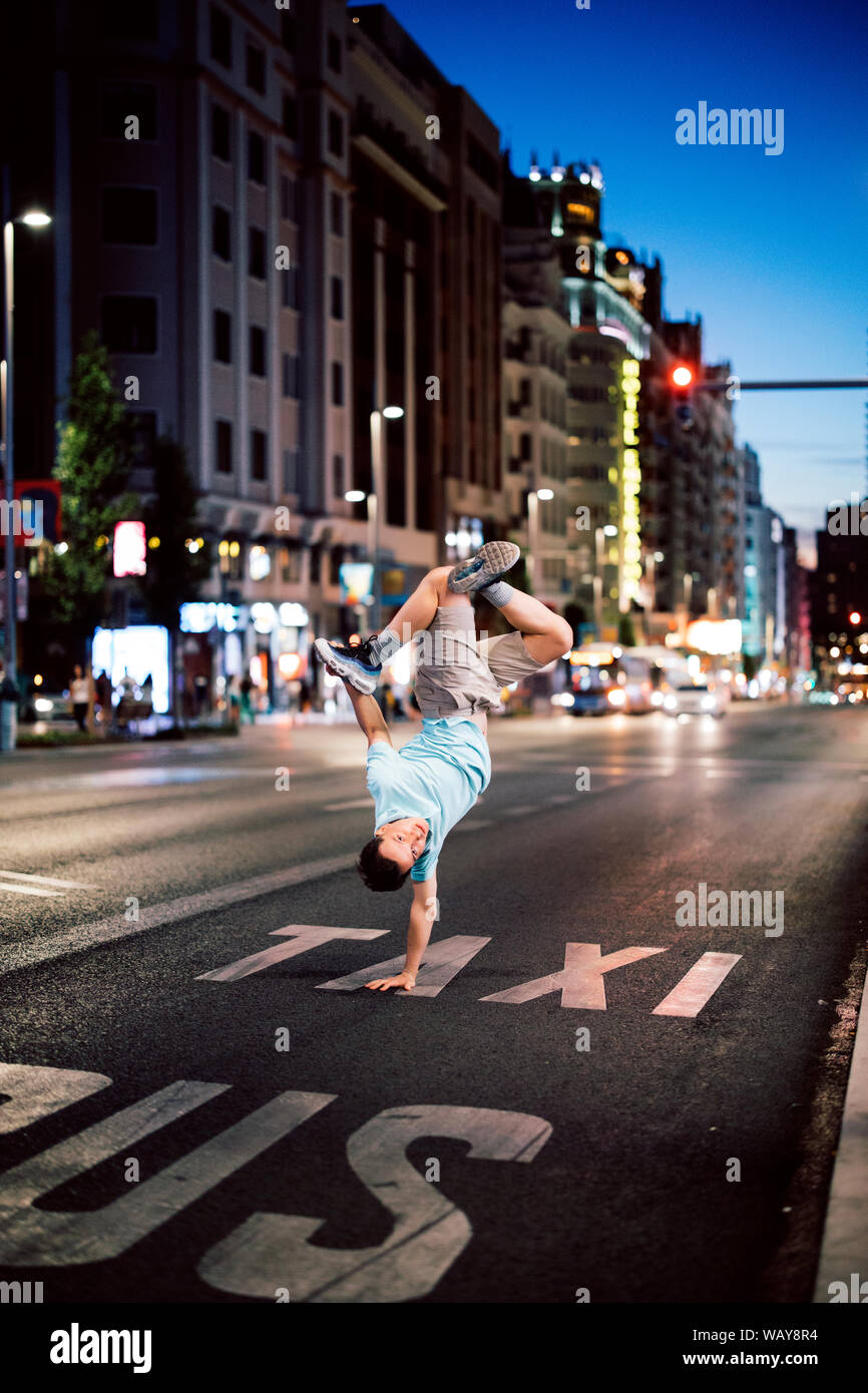 A young man dancing break dance on the night city road Stock Photo - Alamy