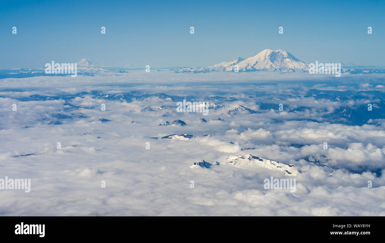 4 Pacific Northwest volcanoes from airplane on approach to Seattle ...